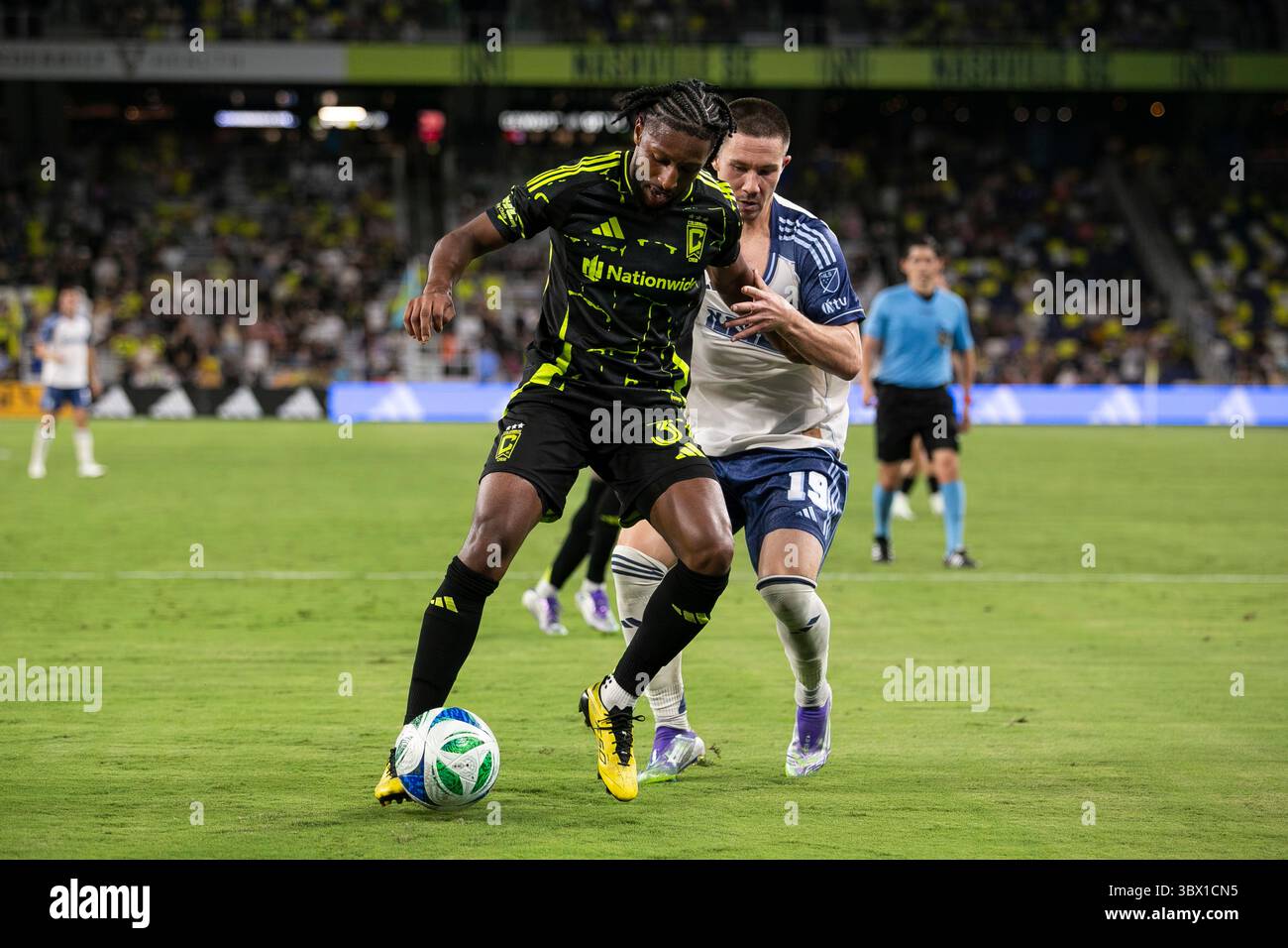 Nashville SC midfielder Alex Muyl (19) and Columbus Crew defender ...