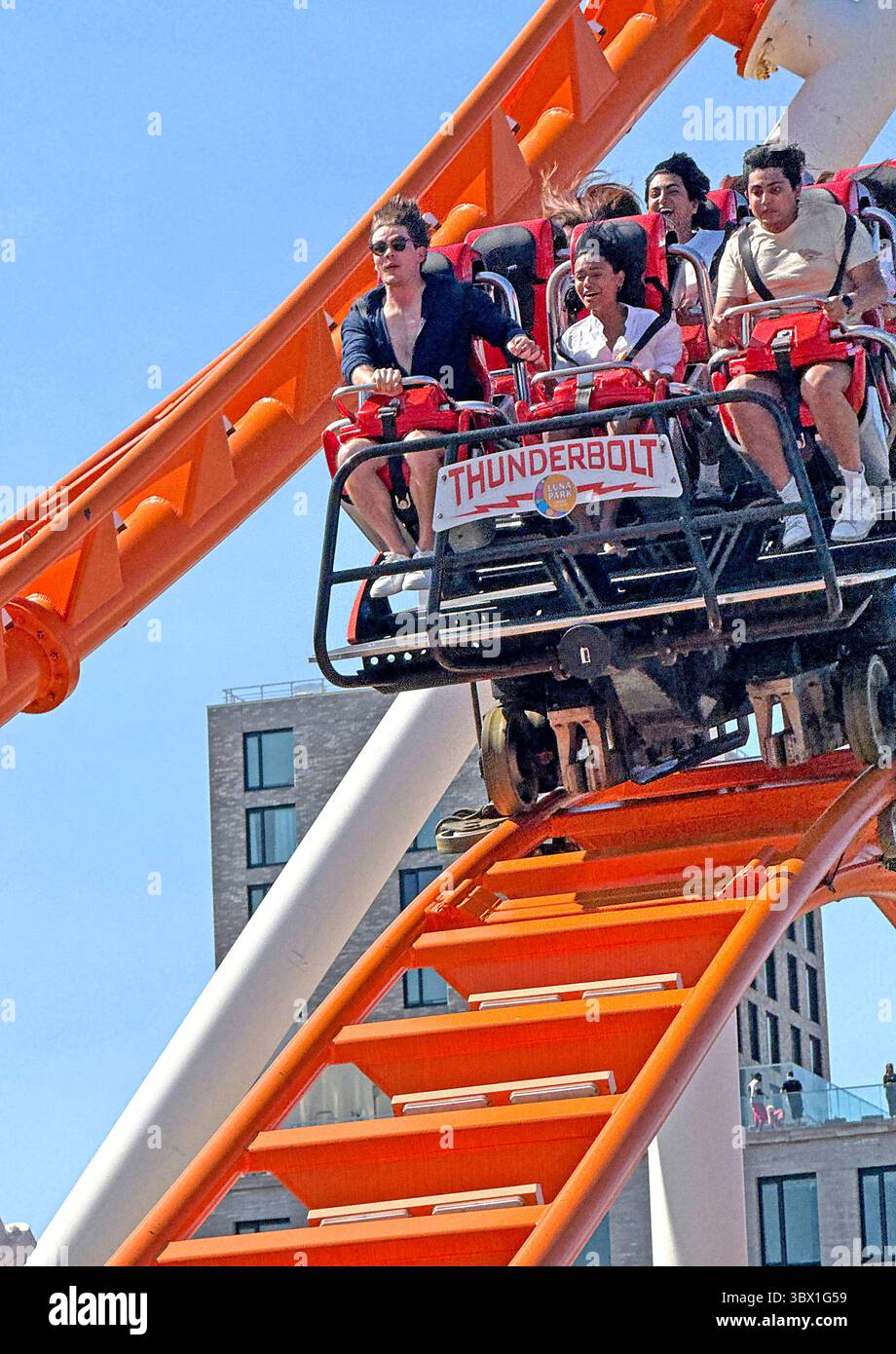 Riders have an exhilarating and scary time on the Thunderbolt Roller ...