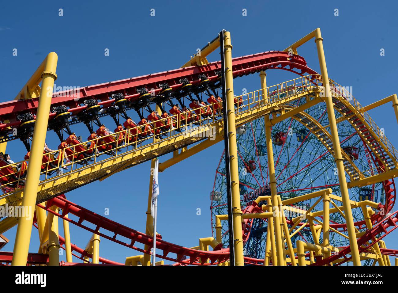 Roller coaster with the Wonder Wheel in the background at the amusement ...