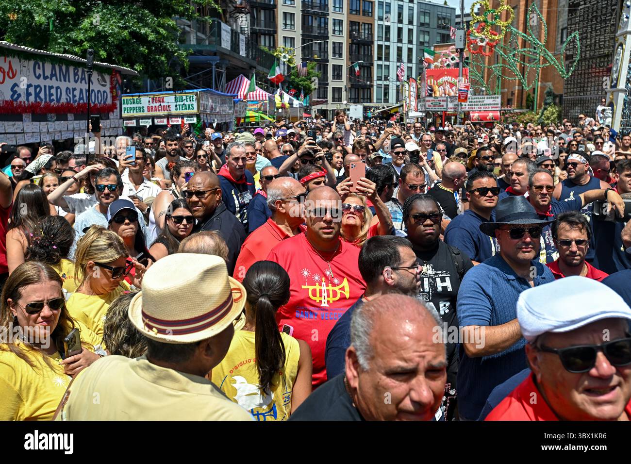 People watch as lifters carry a 80-foot tall, 4-ton Giglio tower near ...