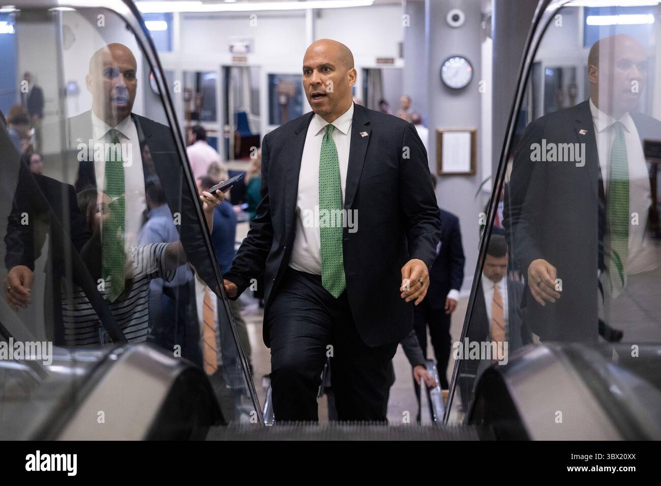 Sen. Cory Booker (D-N.J.) ascends on an escalator on his way to a vote ...