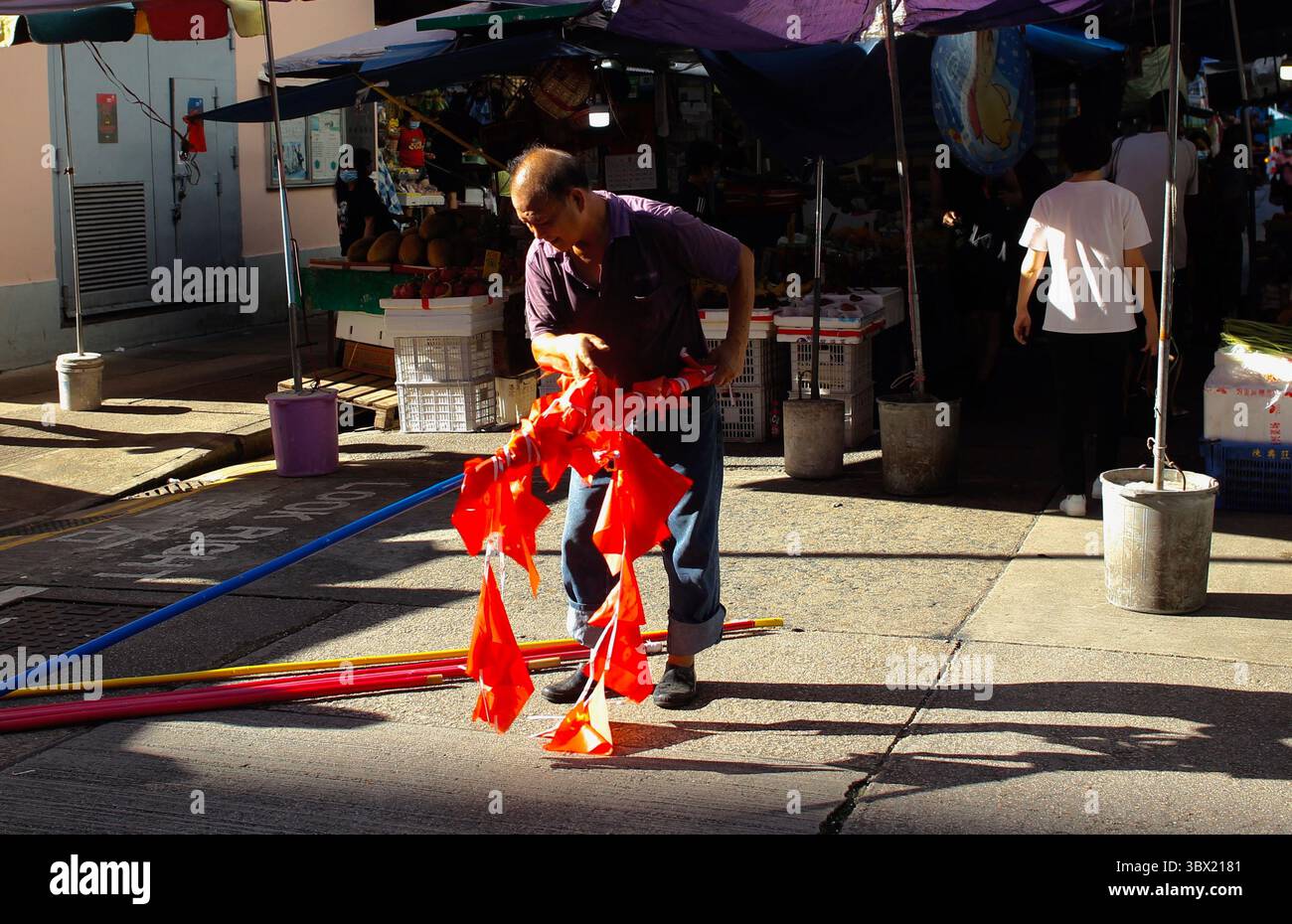 August 16, 2021, HONG KONG, CHINA: Janitor removes small PRC national ...