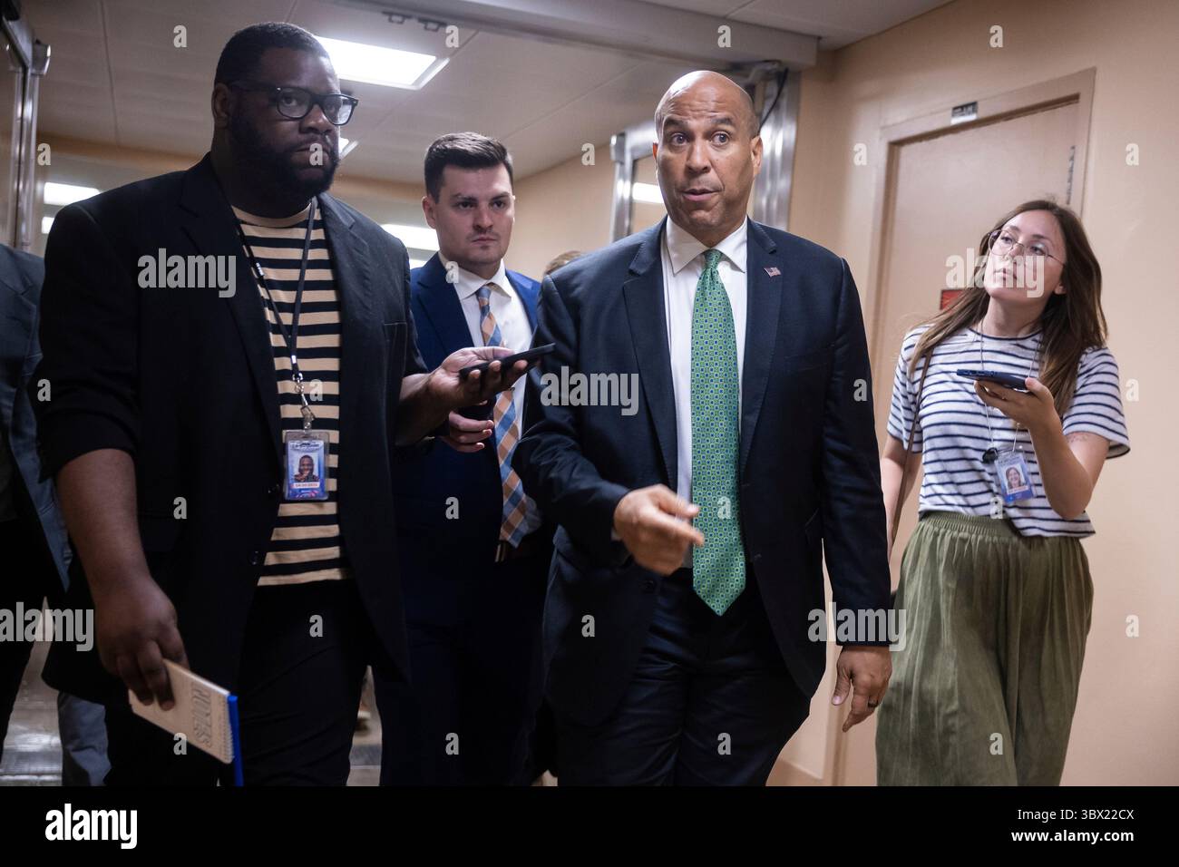 Sen. Cory Booker (D-N.J.) speaks with reporters on his way to a vote at ...
