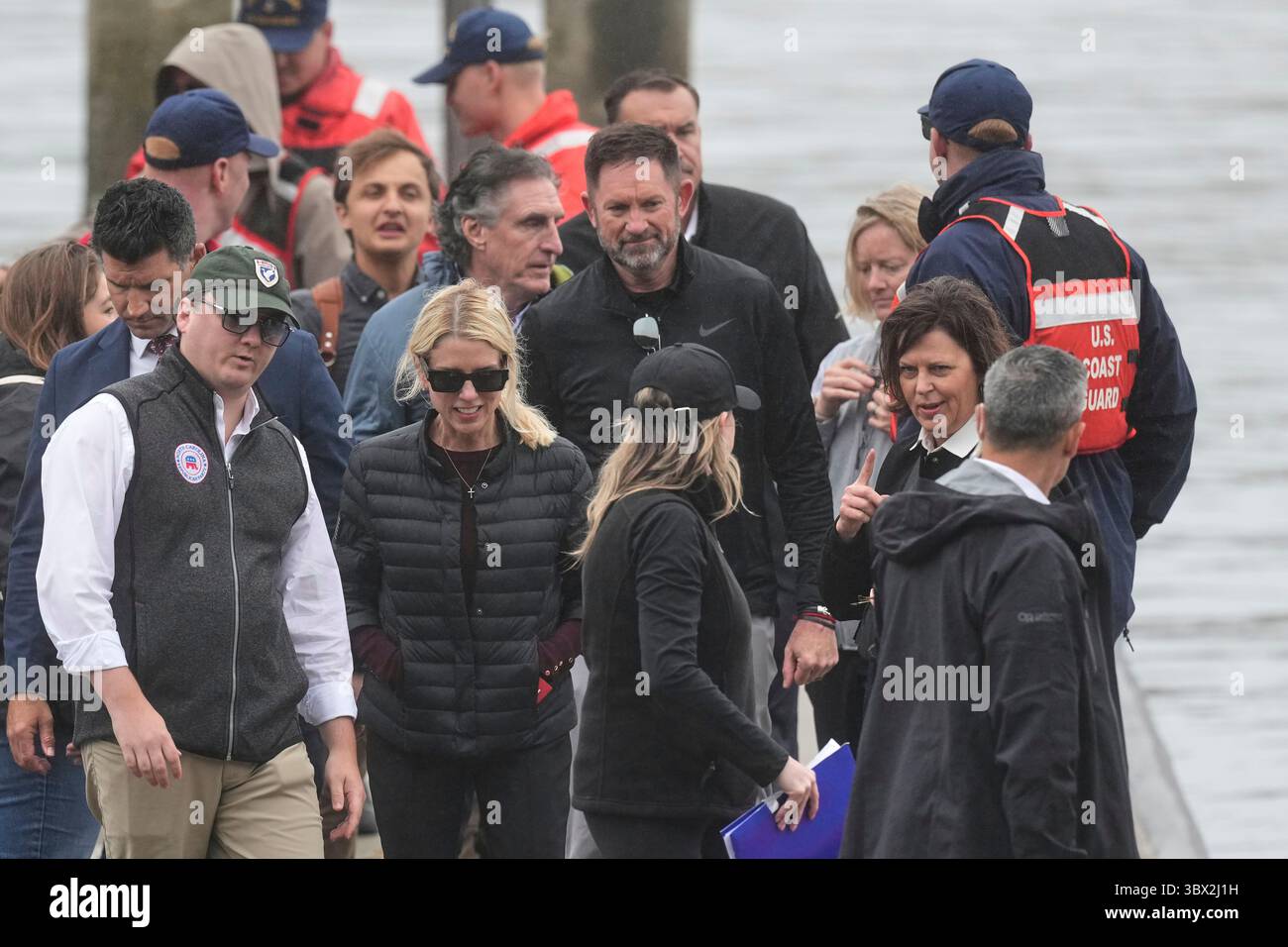Attorney General Pam Bondi, center left, arrives at Fort Baker after ...