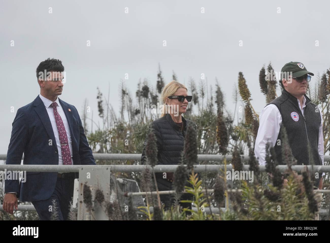 Attorney General Pam Bondi, center, arrives at Fort Baker after ...