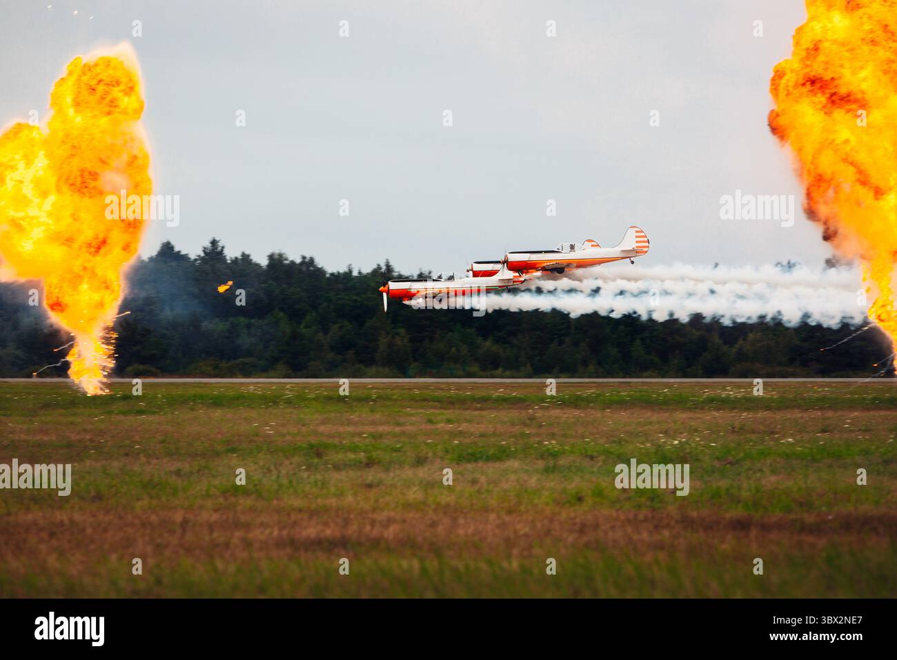 Group of airplanes fighters fly fast between fire explosions at the ...