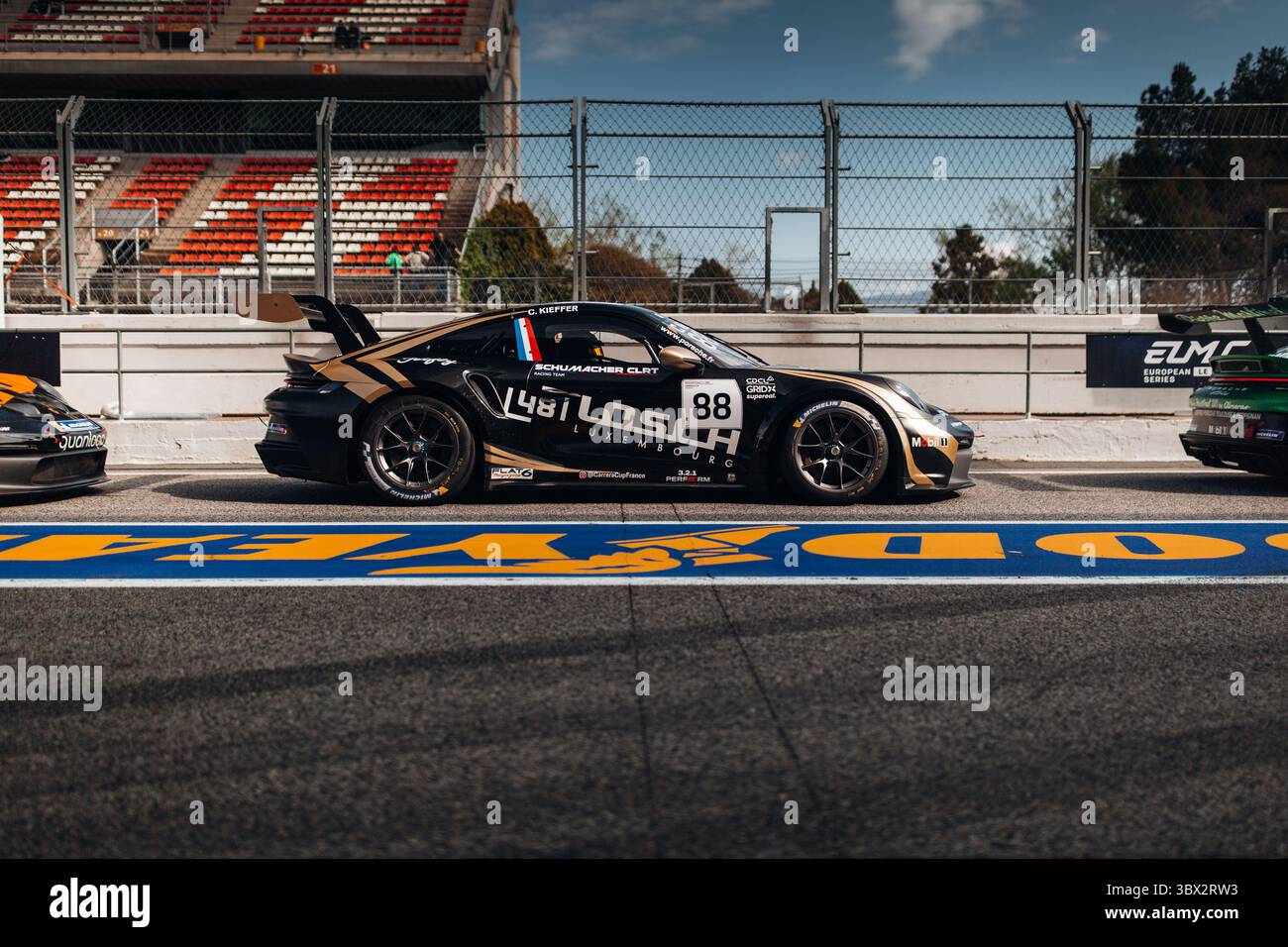 Porsche 911 GT3 Cup on the pit lane during pit stop and tyre change ...