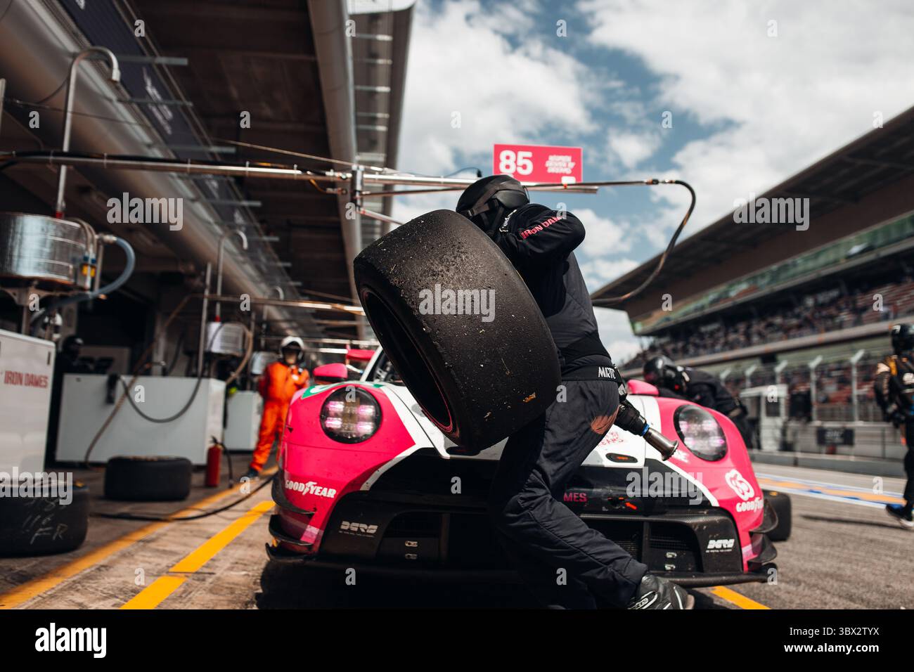 Porsche 911 GT3 Cup on the pit lane during pit stop and tyre change ...