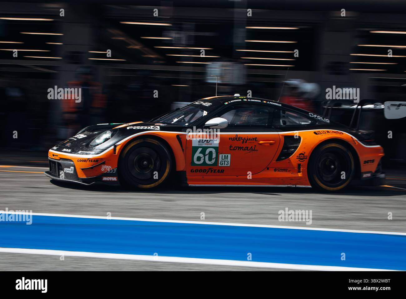 Porsche 911 GT3 Cup on the pit lane during pit stop and tyre change ...
