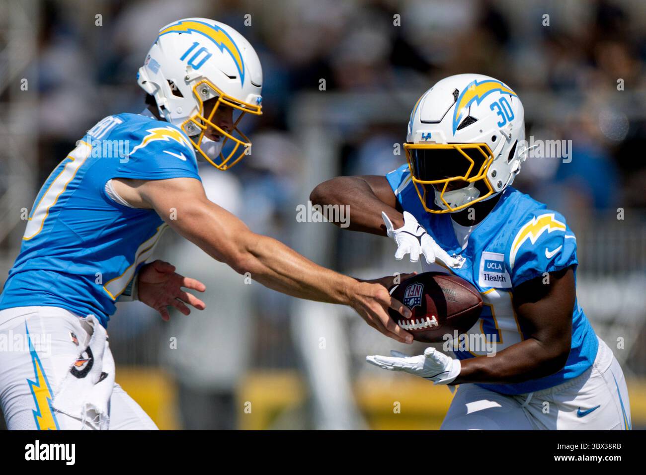 Los Angeles Chargers quarterback Justin Herbert (10) hands off to ...