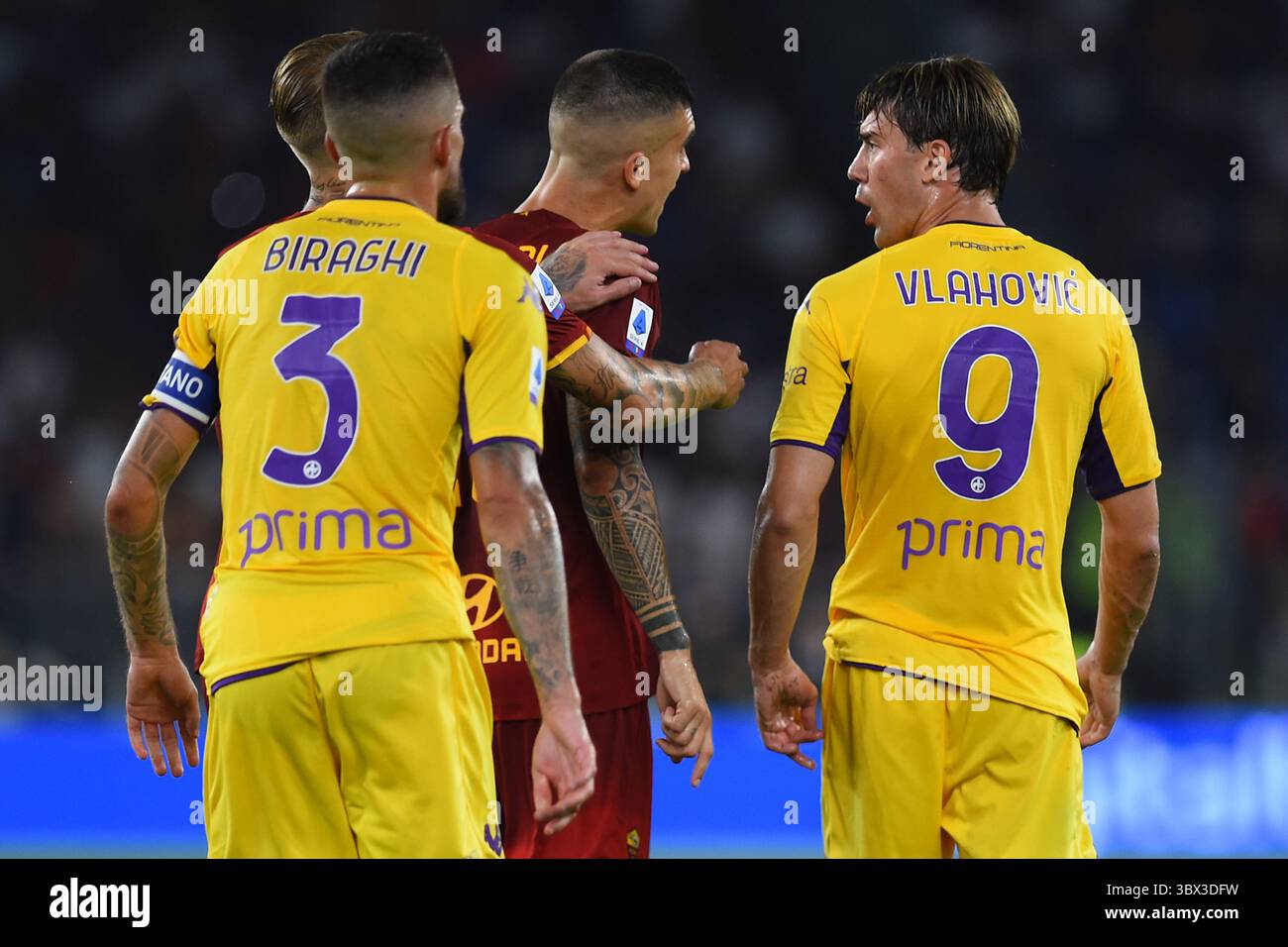 Roma footballer Gianluca Mancini and Fiorentina footballer Dusan ...