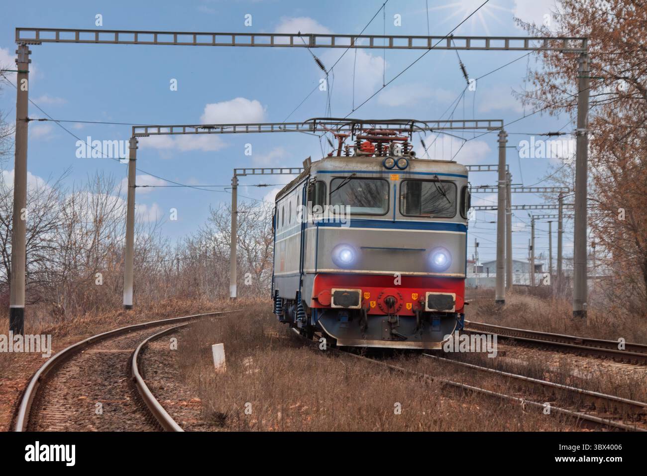 electric locomotive on the railway in Romania, where all trains are ...