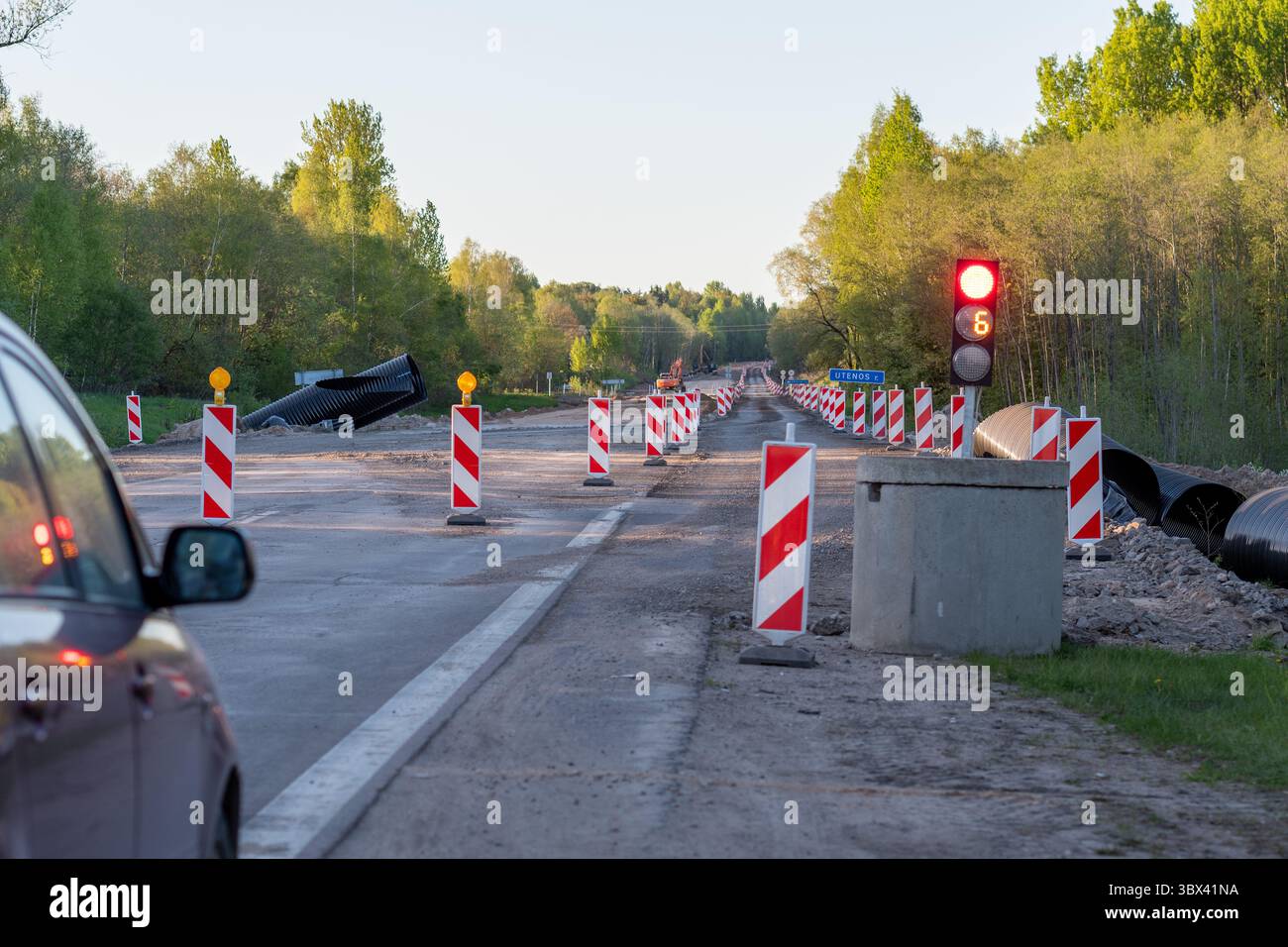 Road under reconstruction, undergoing repair or rebuilding, asphalting, with work in progress ...