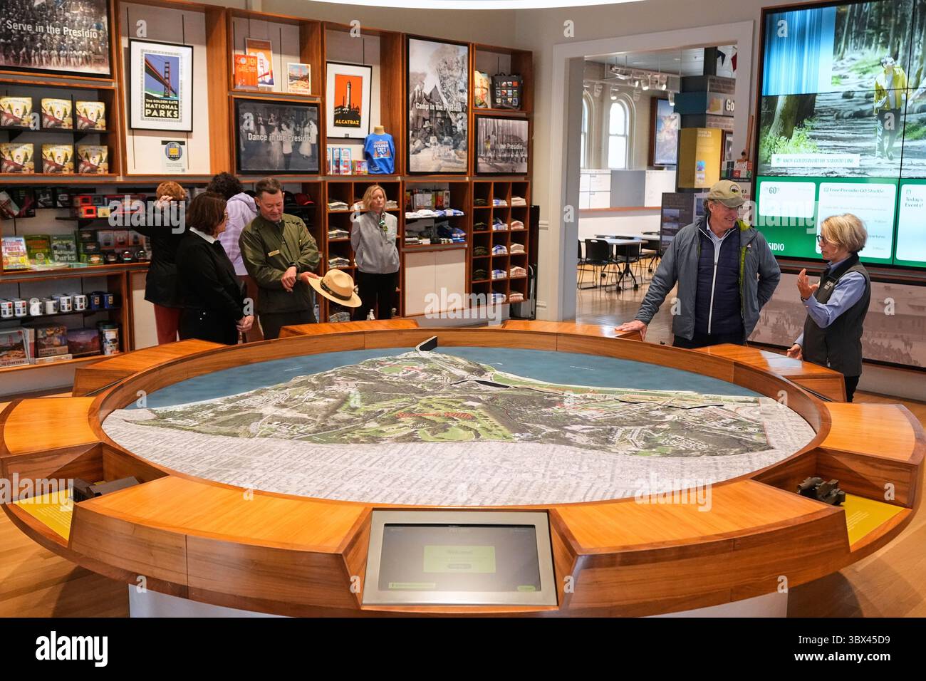 Interior Secretary Doug Burgum, second from right, speaks with Presidio ...
