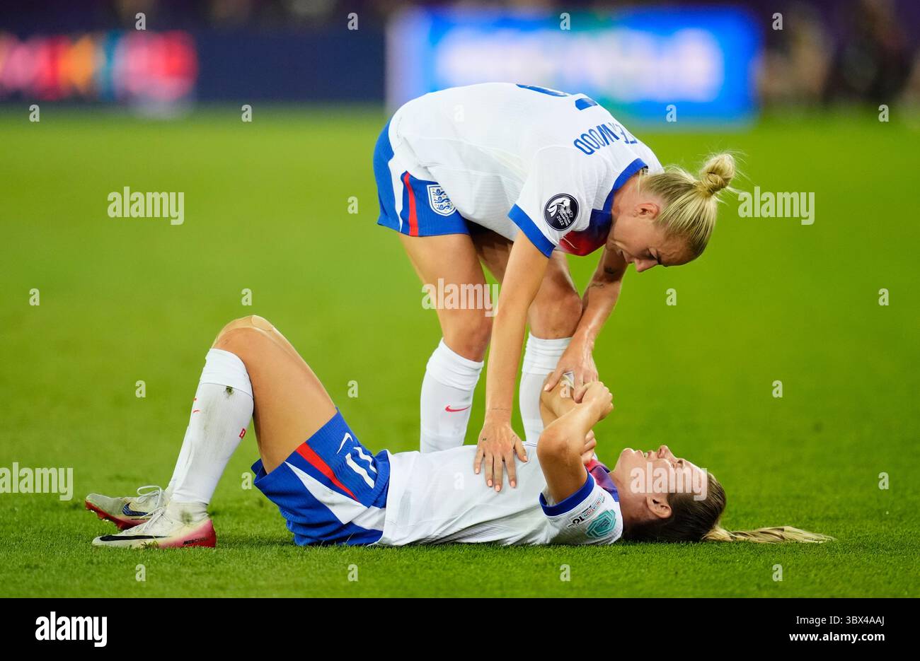 England's Alex Greenwood checks on the condition of team-mate Lauren ...