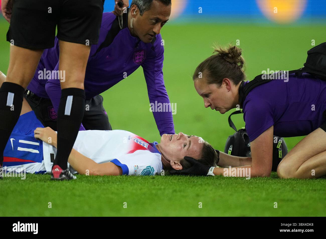 England's Lauren Hemp gets assistance after getting injured during the ...