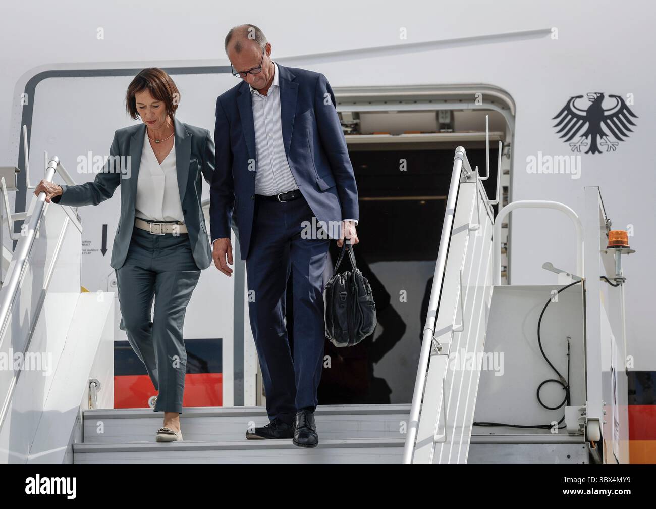 Calgary, Canada. 15th June, 2025. German Chancellor Friedrich Merz, right, and his wife ...
