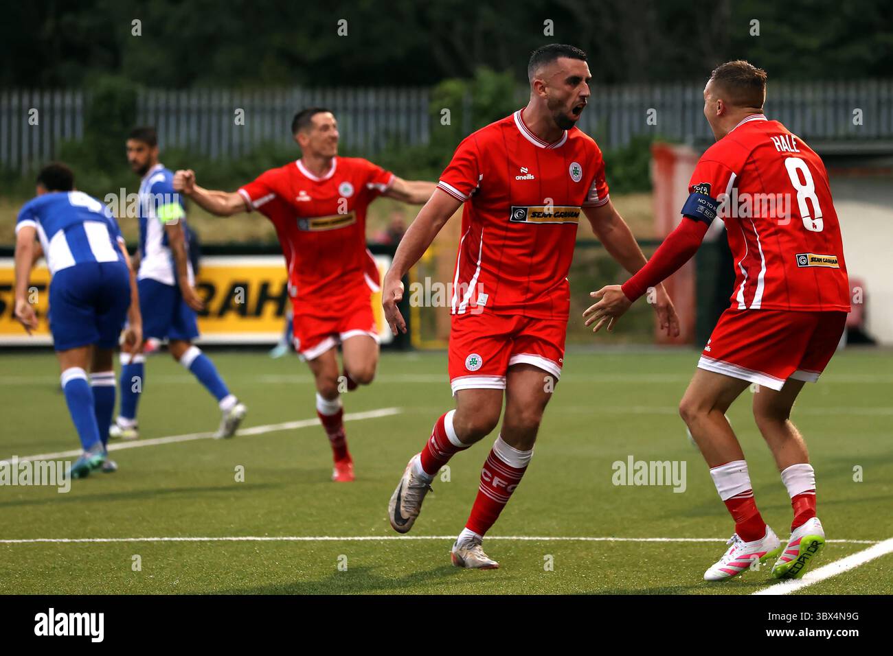 Cliftonville's Joe Gormley (second right) celebrates scoring their side ...