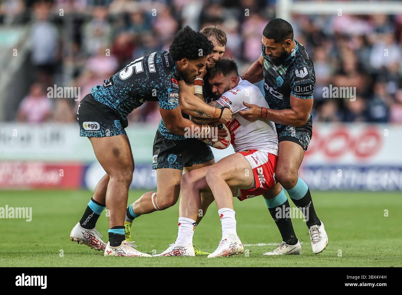 Kyle Feldt of St. Helens is tackled during the Betfred Super League ...
