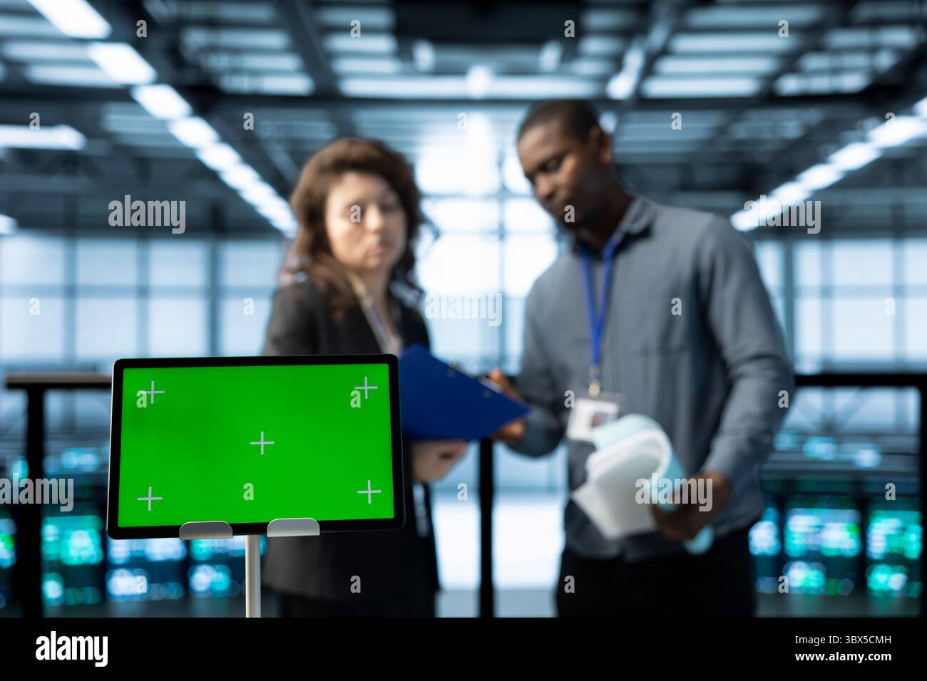 Green screen laptop used by system administrators in data center ...