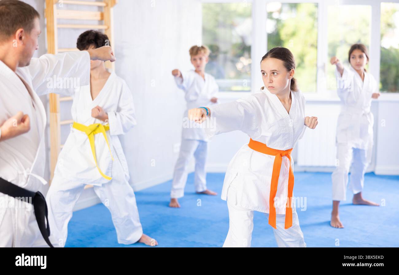 Children students repeat position and perform sequence of punches and ...