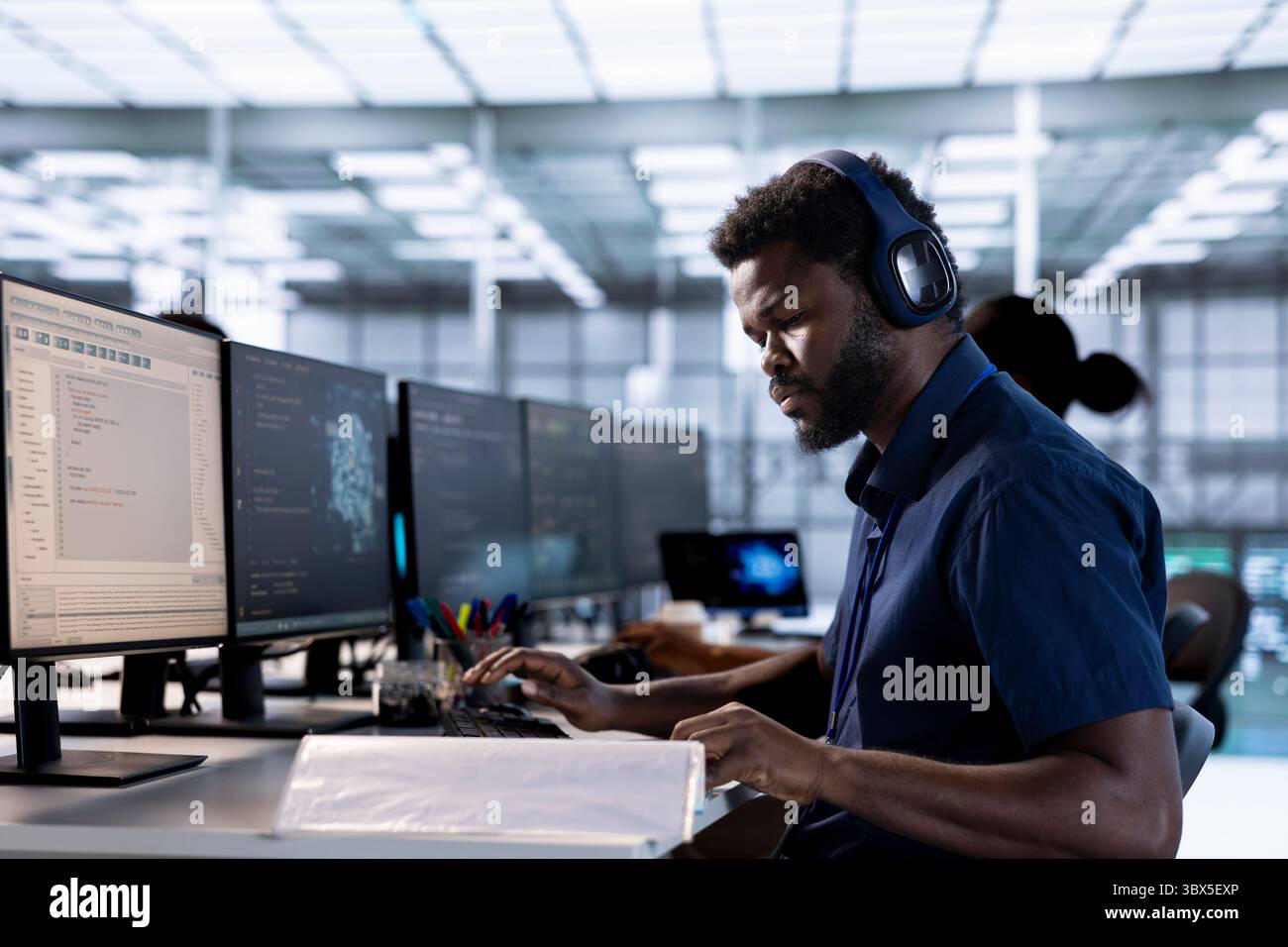 Server room programmer listening music, looking over paperwork after ...