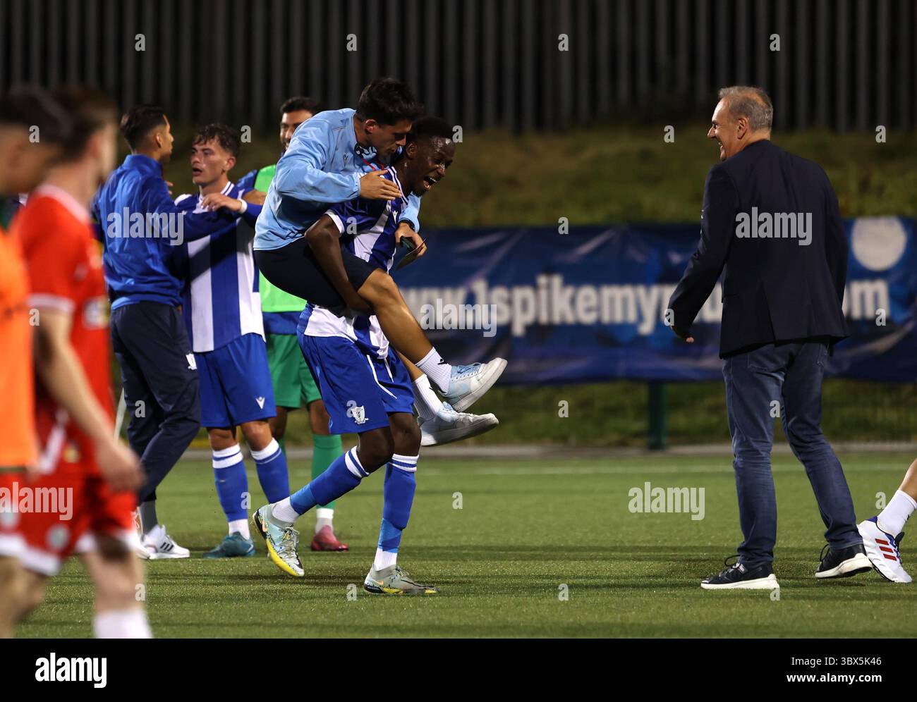 St Joseph's staff and players celebrate following the UEFA Conference ...