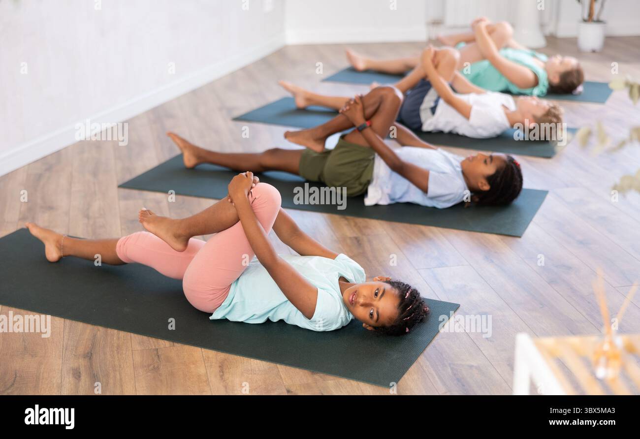 Group multiethnic children doing hi-res stock photography and images ...