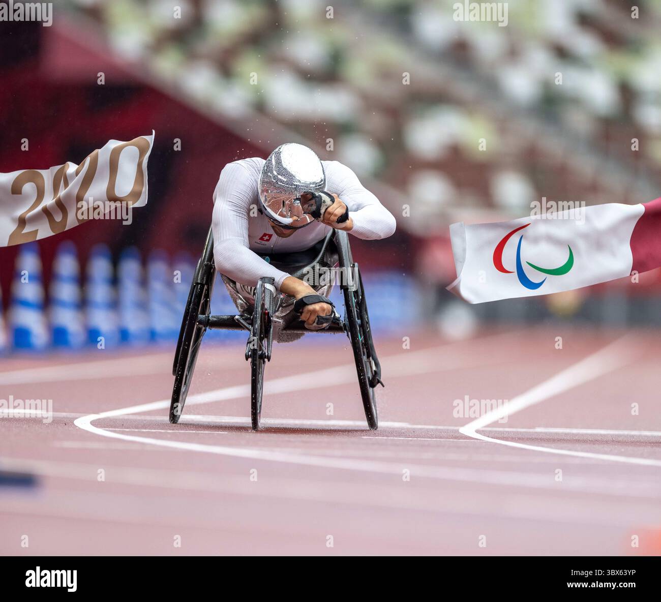 September 5, 2021, Tokyo, Japan: Marcel Hug SUI breaks the tape to ...