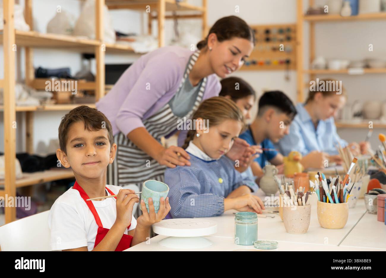 Boy at a master class for children on ceramics Stock Photo - Alamy