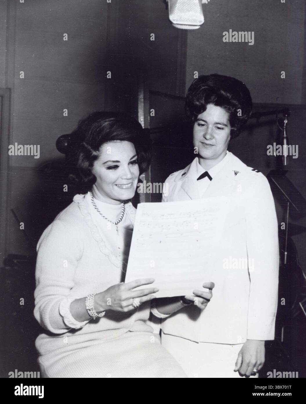 CONNIE FRANCIS looks over a '' Nurse in the US Army'' with Captain Jane ...