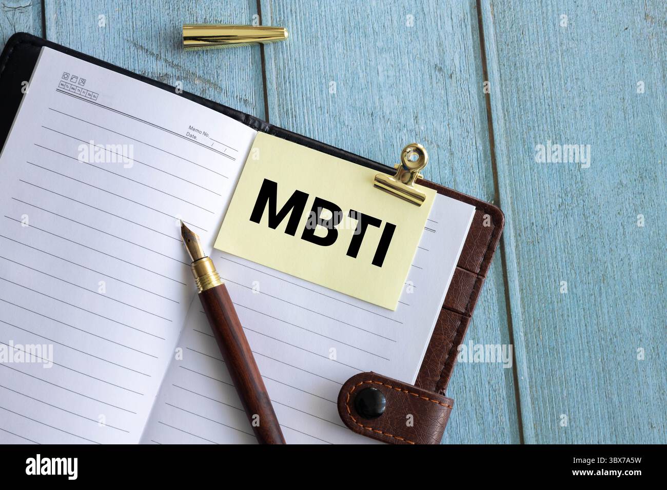 MBTI acronym, word on wood blocks on desk with books. Psychological ...