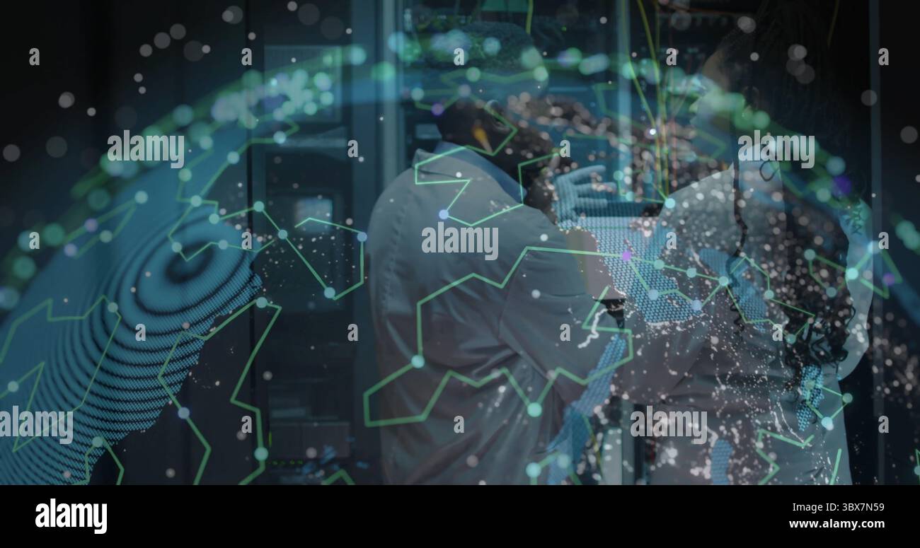 Technicians examining servers in data hi-res stock photography and ...