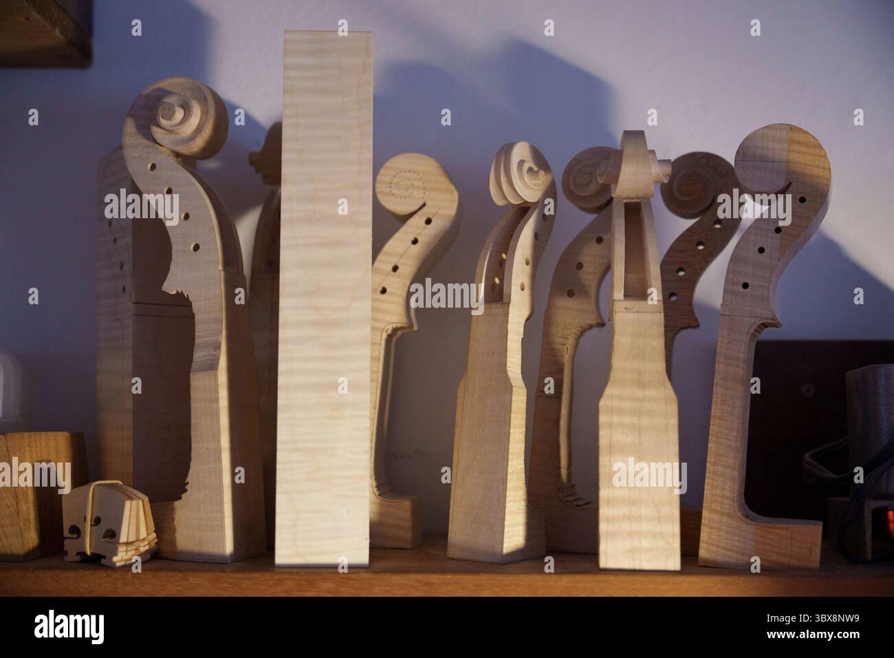 Violin scrolls sit on the workstation of Malaysian luthier Tan Chin ...