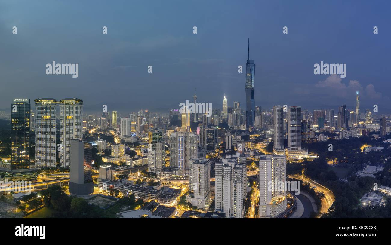 Panoramic view of the Kuala Lumpur skyline at sunset, featuring Merdeka ...