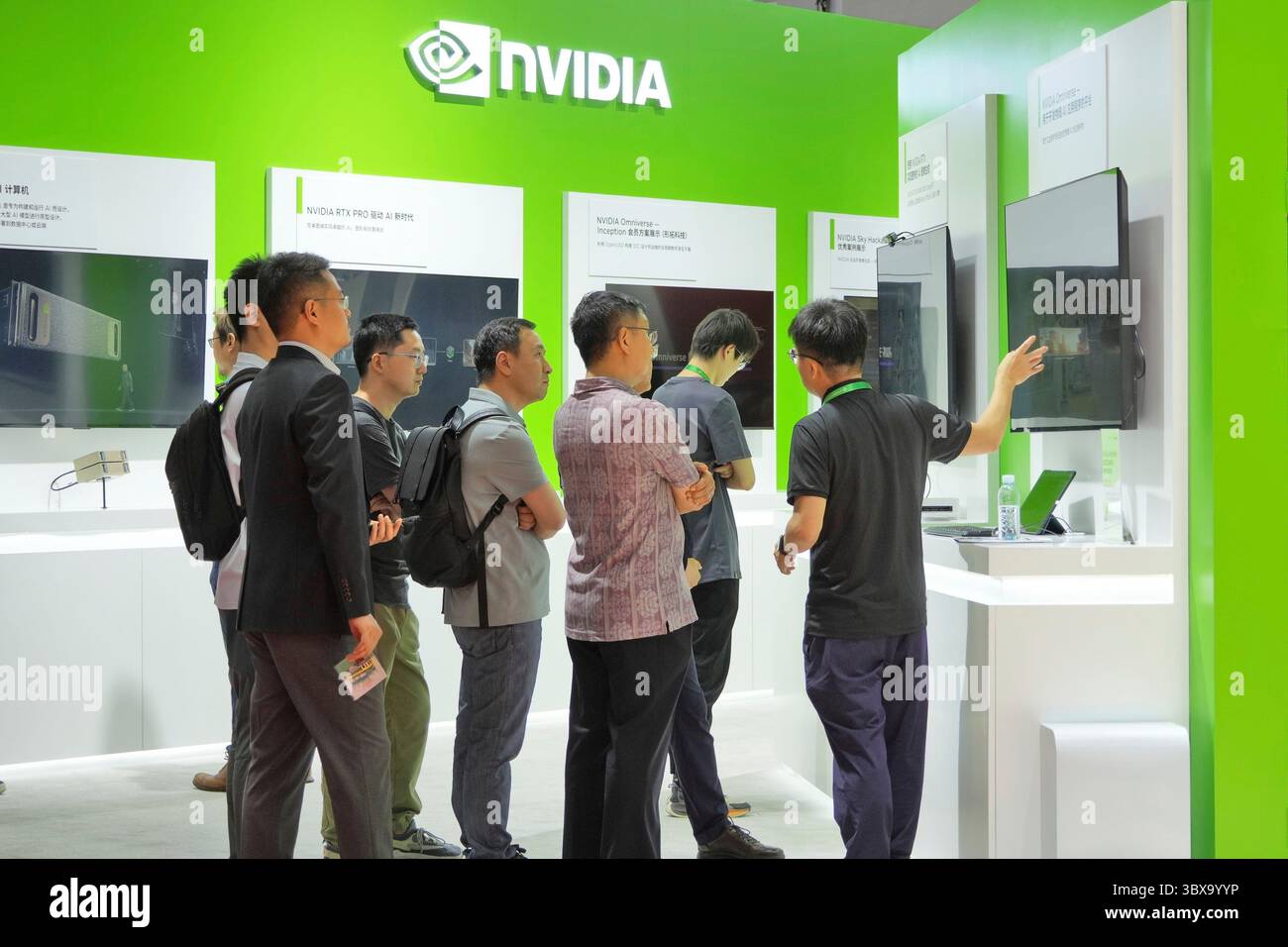 People visit the booth of nVidia, the world's leading GPU maker, at the ...