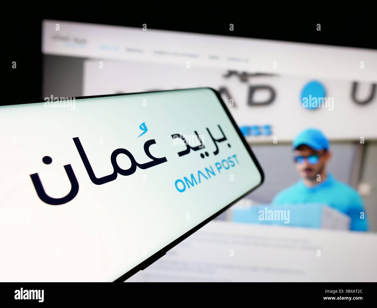 In this photo illustration, a smartphone with the logo of Omani postal ...