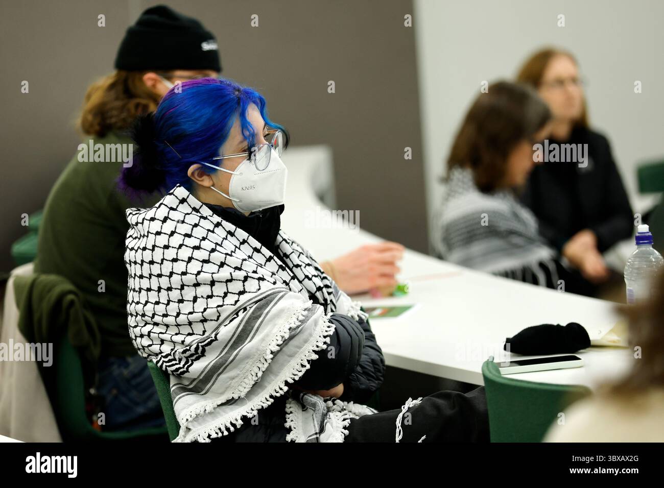 People are seen during an inquiry examining freedom of speech and ...