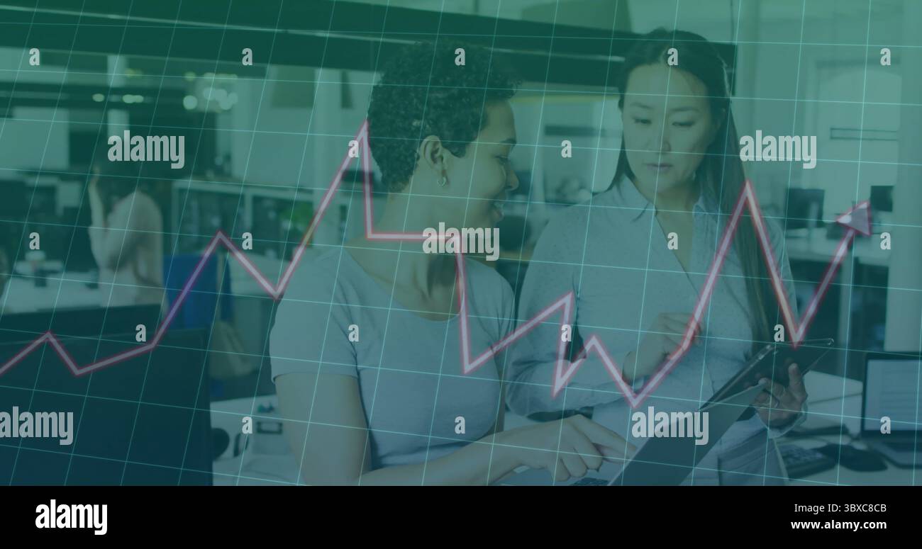 Two colleagues reviewing business data hi-res stock photography and ...