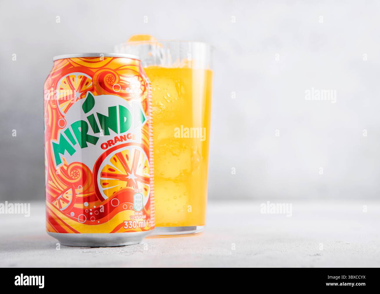 LONDON,UK - MARCH 11, 2025: Mirinda Orange soda soft drink and glass ...
