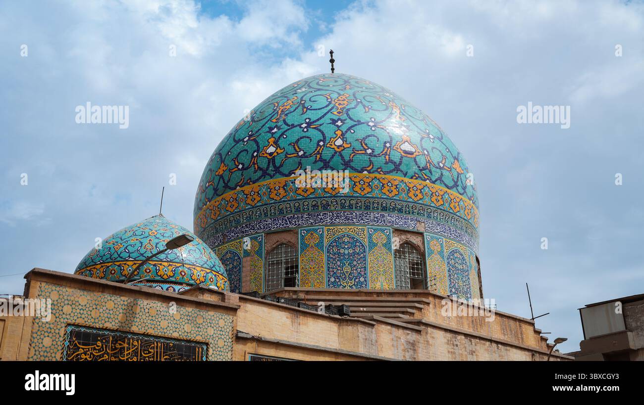 Colorful domes of a mosque rise above the historic streets of Baghdad ...