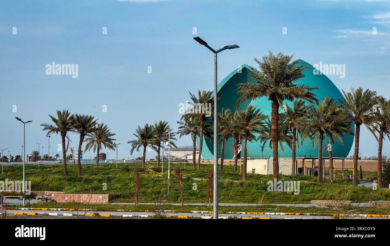 Modern architecture contrasts with palm trees in Baghdad, showcasing ...
