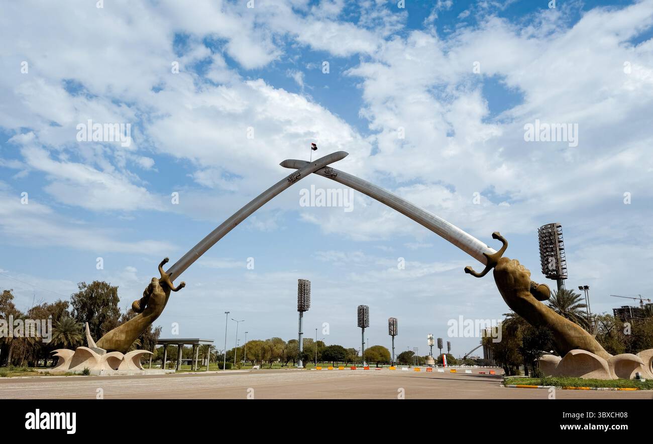 In Baghdad, Iraq, a striking monument features two swords crossing over ...