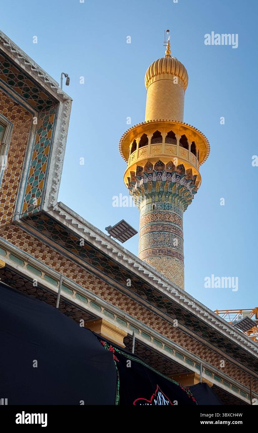 A towering minaret stands proudly in Baghdad, showcasing detailed tile ...