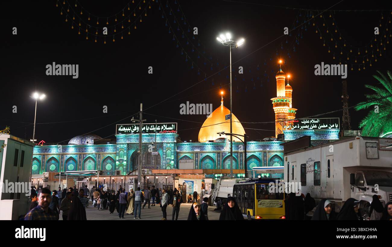 Visitors walk through Al Hussein shrine in Karbala, Iraq illuminated at ...