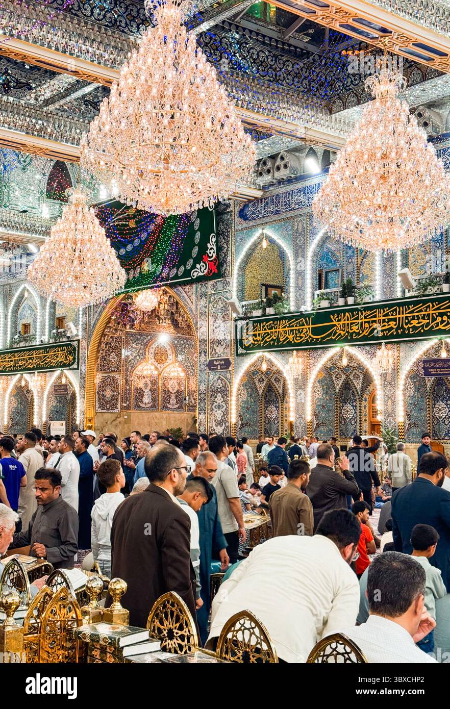 Crowds gather inside the ornate shrine of Karbala, Iraq, celebrating a ...