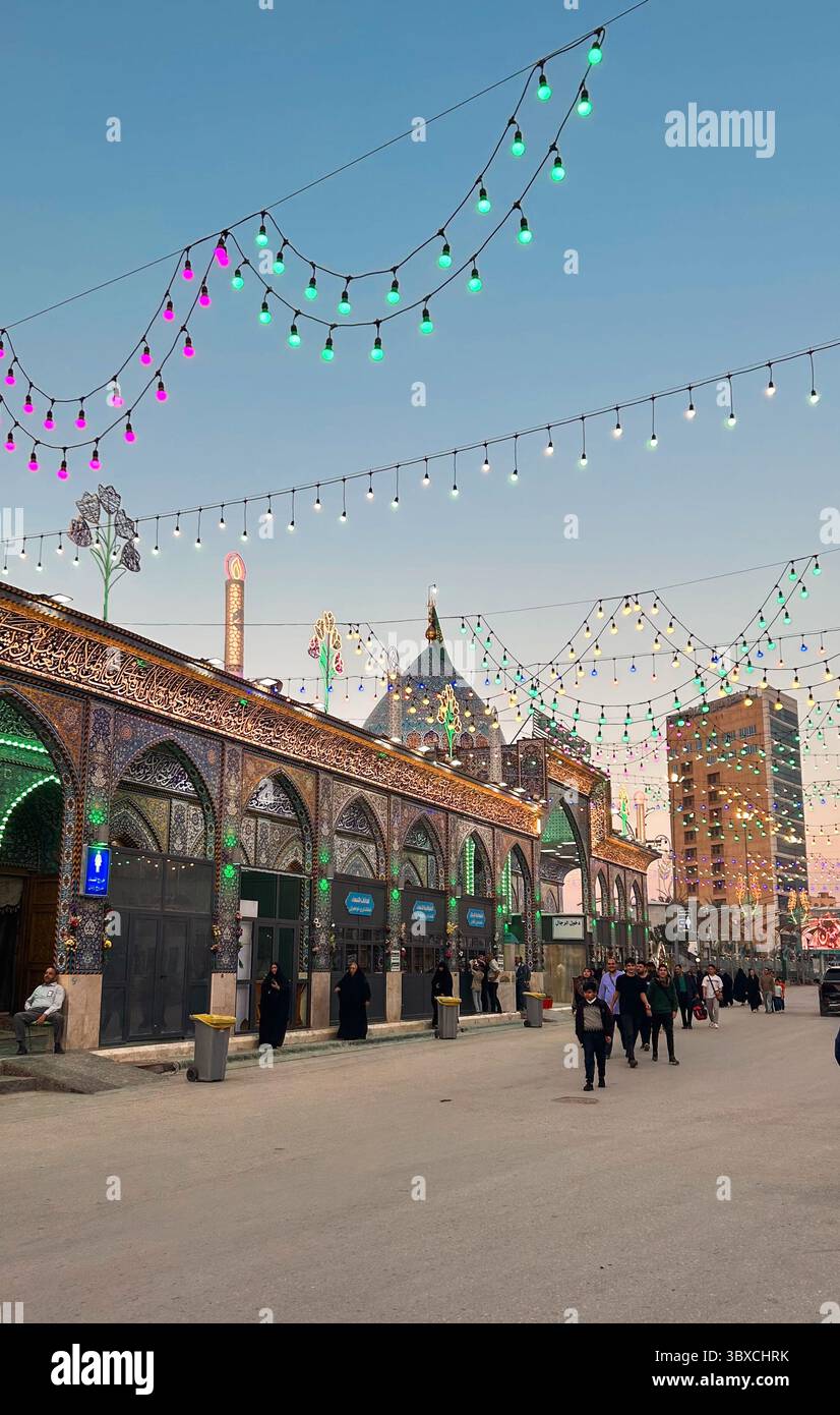 Decorated streets of Karbala are vibrant with colorful lights and ...