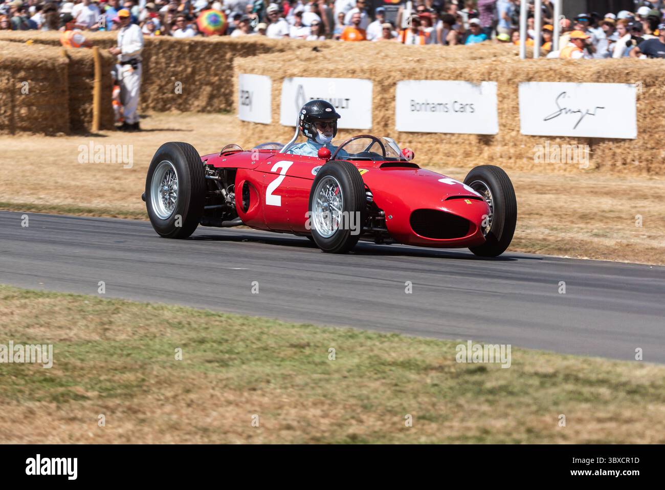 1961 Ferrari 156 'Sharknose' Grand Prix race car driving up the ...