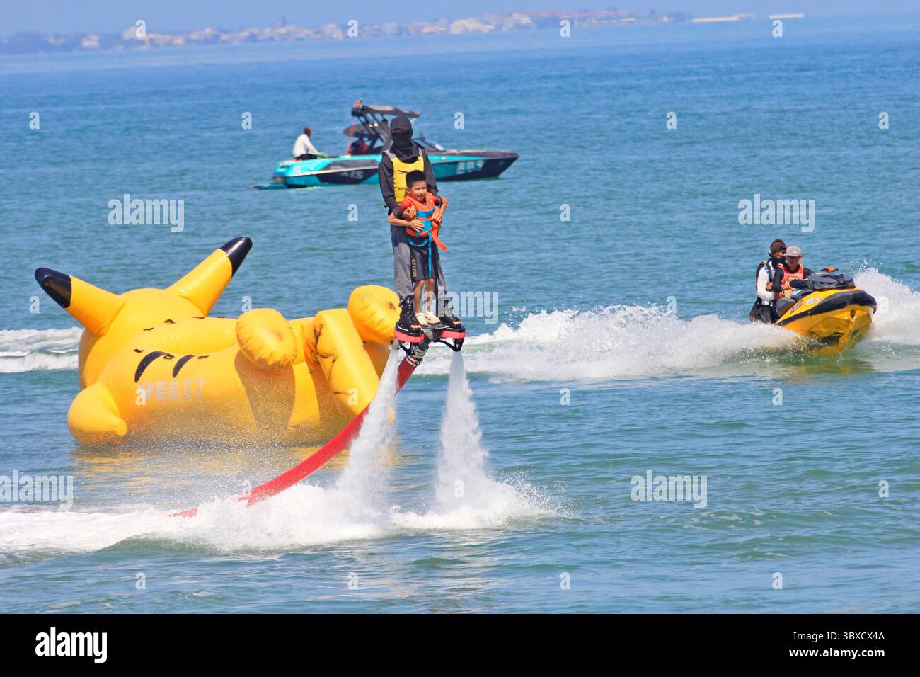 Tourists enjoy summer time in Sanya City, southernmost China's Hainan ...
