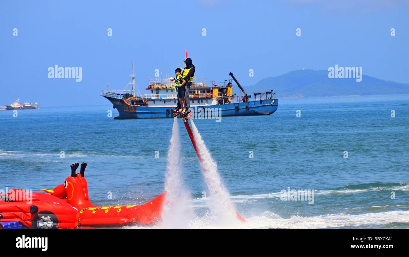 Tourists enjoy summer time in Sanya City, southernmost China's Hainan ...